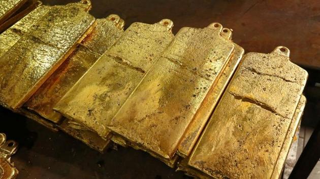 Gold rises as coronavirus concerns lift safe-haven bid | Business News