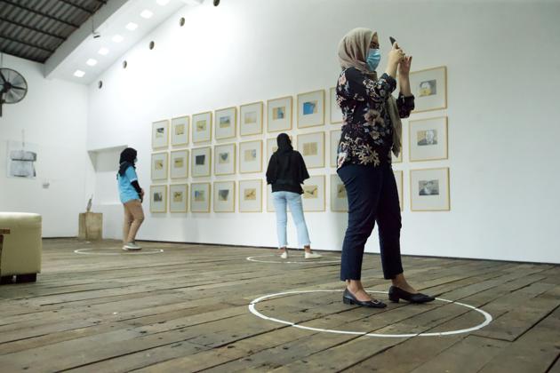 Photos: Indonesia’s art lovers practise social distancing inside ...