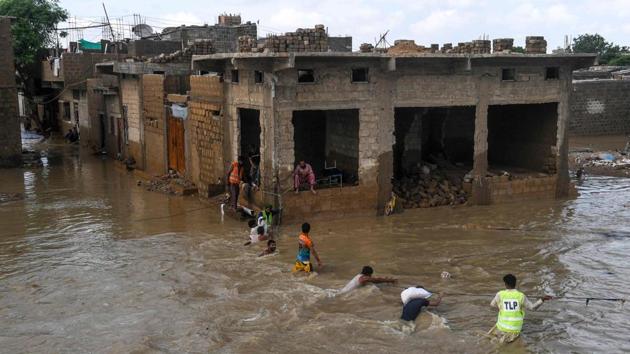 Photos: Highest August rains on record leave Karachi inundated ...