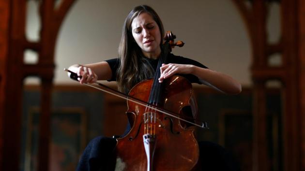 Healing art: Cellist performs classic works against backdrop of ...