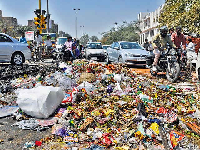 Sanitation staff litter garbage on streets to protest delayed salaries ...