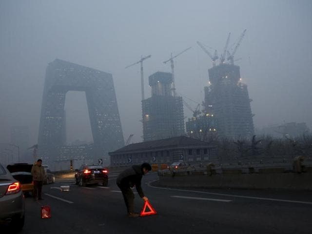 The pall of smog hangs over Beijing as red alert continues | World News