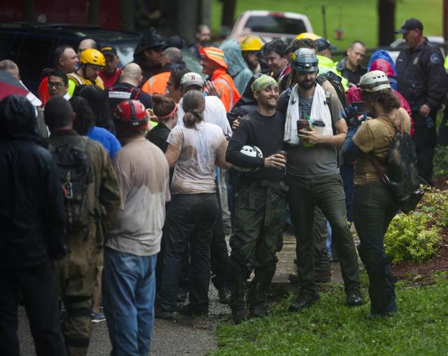 Pitch black cave, neck-deep water: How 19 people escaped a flash-flood ...