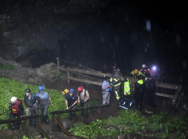Pitch black cave, neck-deep water: How 19 people escaped a flash-flood ...