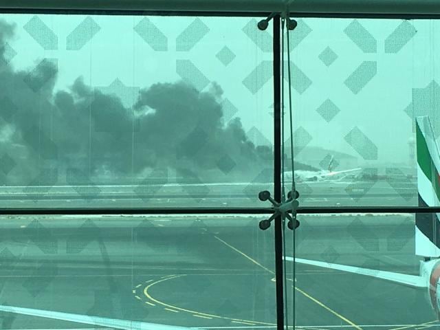 In pics: How 300 people escaped a crash-landed Emirates flight at Dubai ...