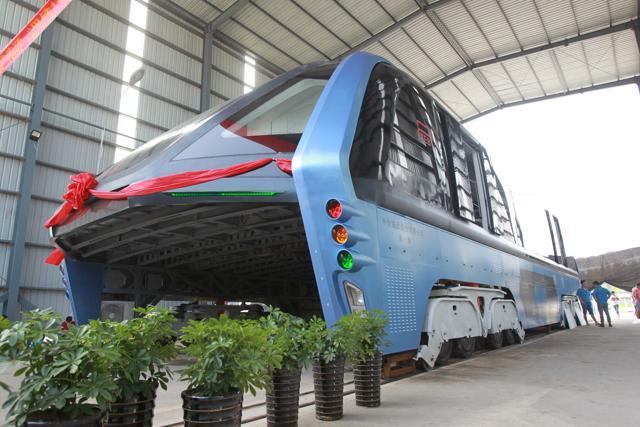 China tests straddle bus that allows cars to pass beneath it | World News