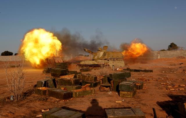 In pics: Rockets fly, gunfire rings out as US-backed Libyan forces push ...