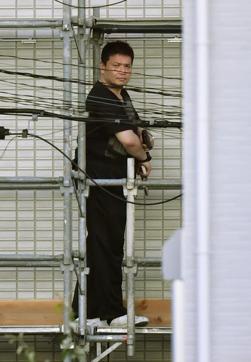 In pics: Japan gunman in deadly shooting captured after standoff ...