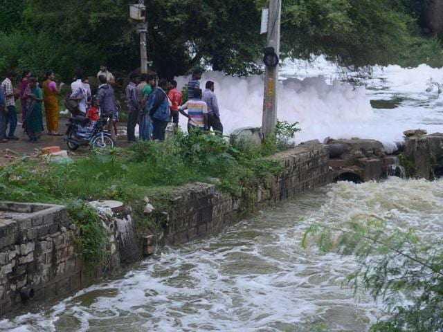 In pics: Andhra rains turn roads into rivers, parking lots submerged ...