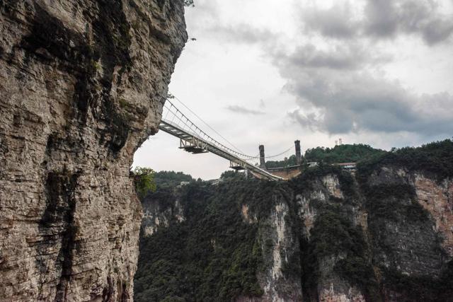 Look down! World’s longest, highest glass-bottomed bridge reopens in ...