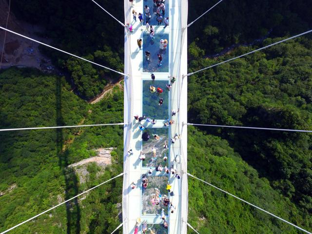 Look down! World’s longest, highest glass-bottomed bridge reopens in ...