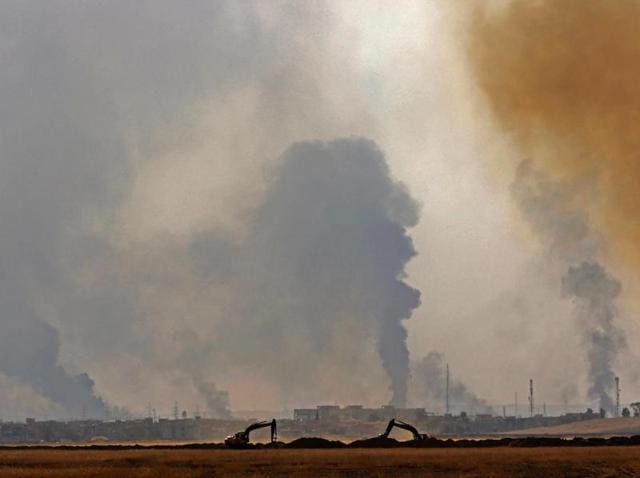 Suicide bombers, mortar fire as Iraqi forces battle IS in village ...