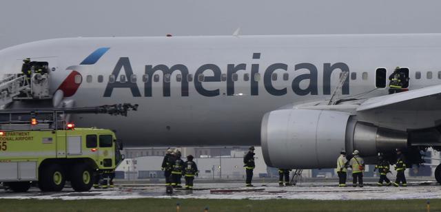 The burning plane: Flight evacuated at Chicago airport after engine ...