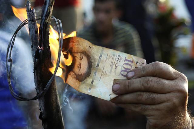 In pics | Burning notes, looting: How Venezuela reacted to ...