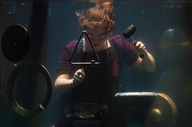 This Danish band performs while submerged in water tanks, like fish in ...