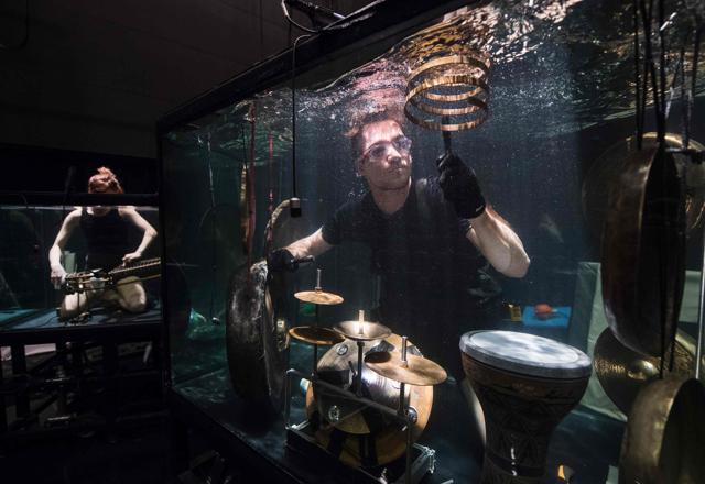 This Danish band performs while submerged in water tanks, like fish in ...