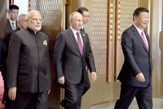 BRICS summit: Modi, Putin talk strategic partnership, cooperation in ...