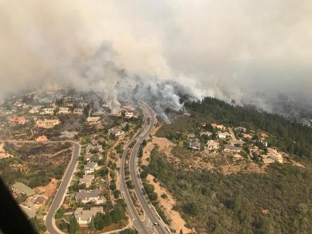 At least 10 dead, 1500 buildings destroyed as wildfires ravage Northern ...