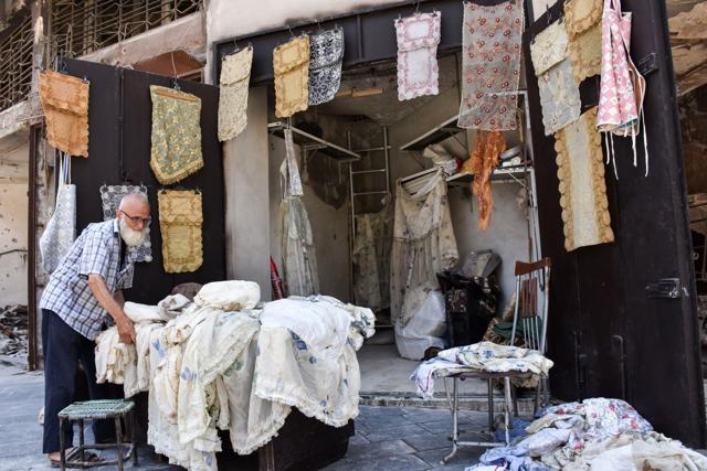 ‘I lost myself’: In rubble of Aleppo souk, tablecloth shop makes ...