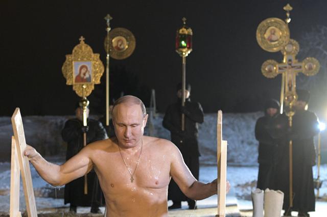 Russia’s Putin takes dip in icy lake to mark Orthodox Epiphany | World News
