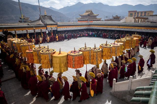 Tibetans greet new year with Buddha thangkas, dancing and rituals. See ...