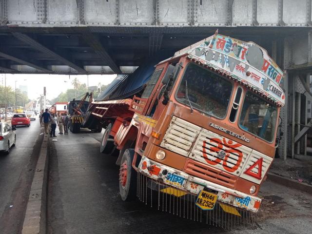 Severe traffic jam after truck gets stuck under bridge, blocks road ...