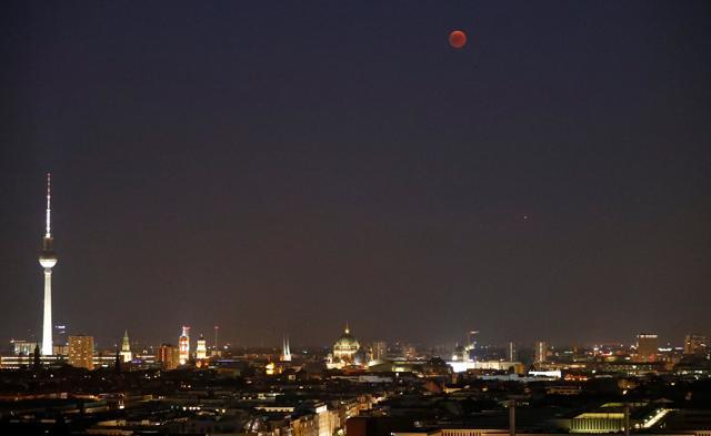 ‘Blood moon’ dazzles skygazers across the world in century’s longest ...