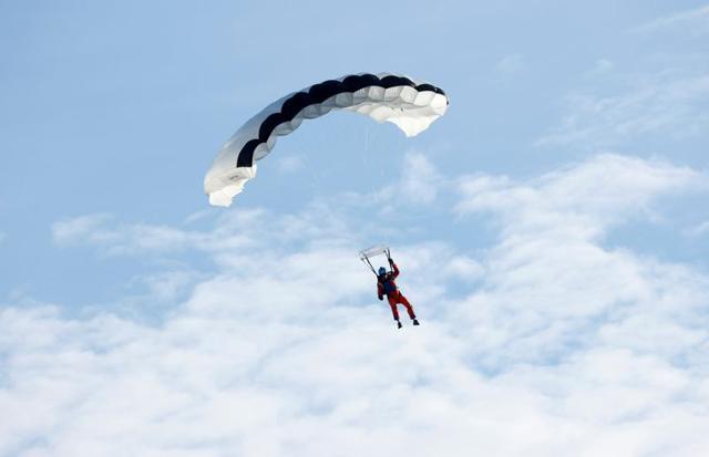 Parachutist completes world’s first skydive from solar-powered plane in ...