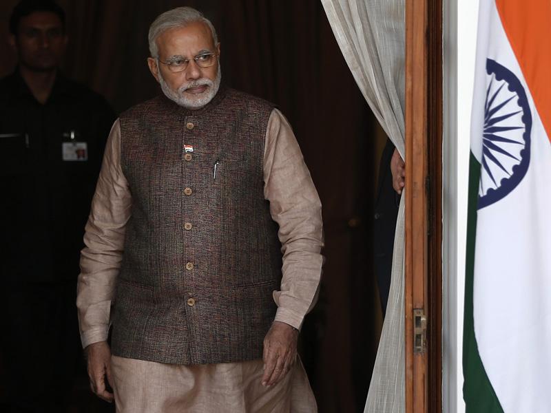 Modi takes trademark energetic style to PMO, clocks 12-hour work days ...