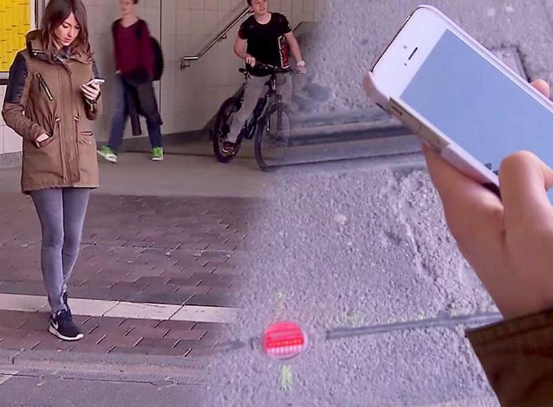 Watch | German city installs traffic lights on pavements to alert ...