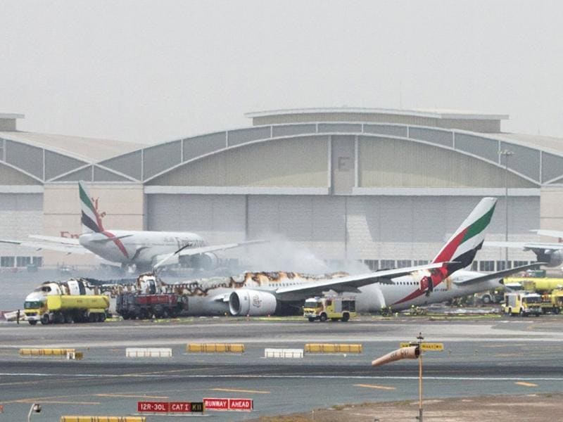 In pics: How 300 people escaped a crash-landed Emirates flight at Dubai ...