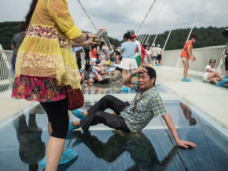 Time for some vertigo: Longest glass-bottom bridge finally opens in ...