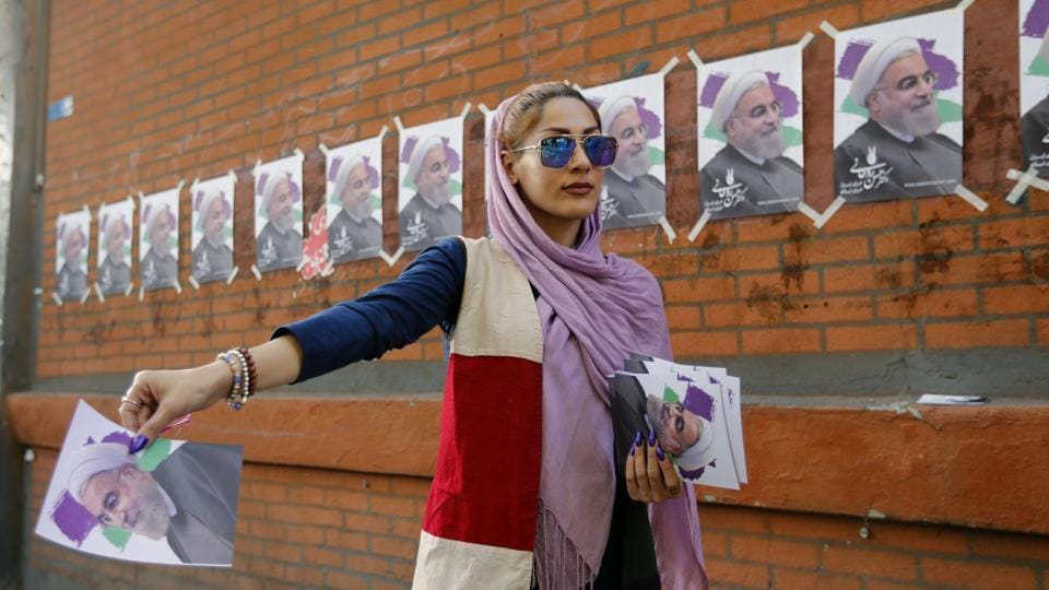 In pics: Iranians take the streets as high-stakes vote goes down to ...
