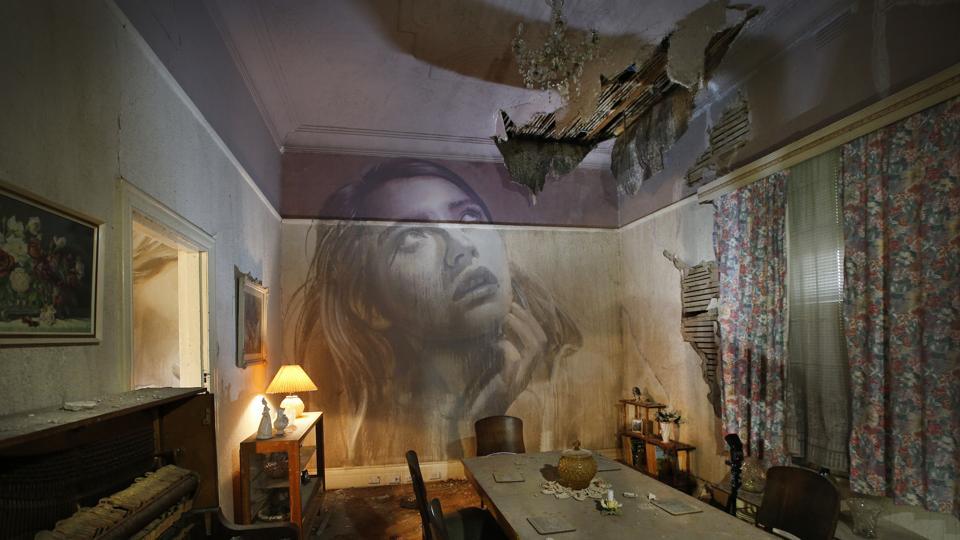 Haunting yet beautiful: A street artist paints walls of abandoned house ...