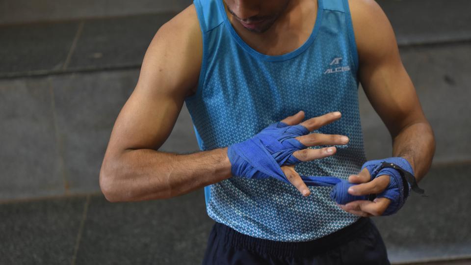 Photos: National boxing medallist struggles as paperboy in Pune ...