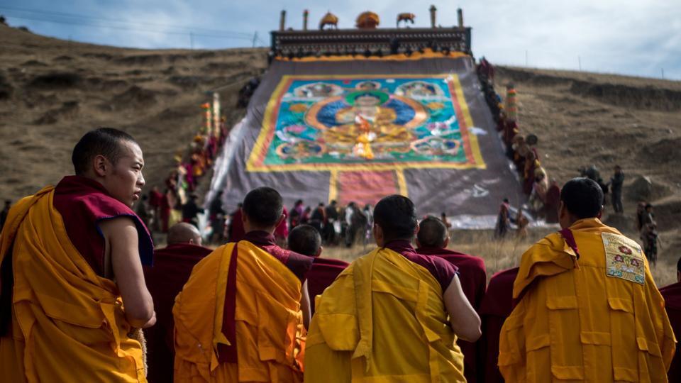 Tibetans greet new year with Buddha thangkas, dancing and rituals. See ...