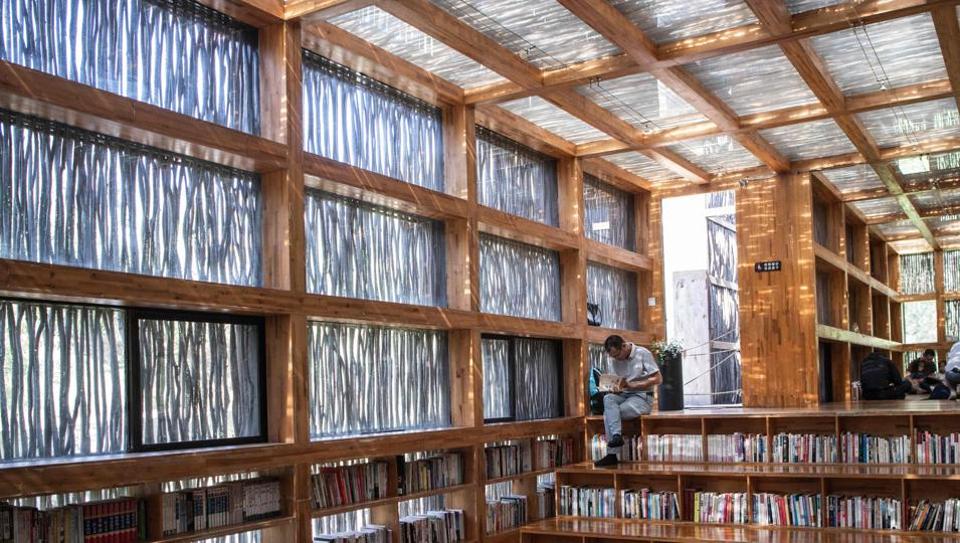 Photos: Wooden library lures bookworms to Beijing wilderness ...