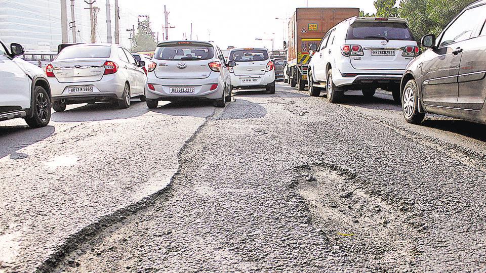 Golf Course Extension Road potholes get temporary fix, stretch to be ...