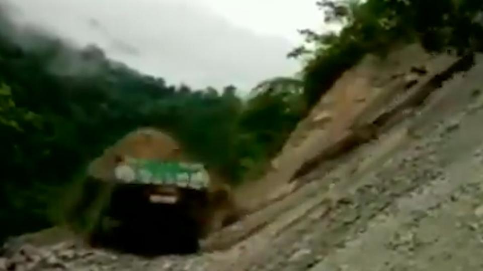 Tractor gets smashed by huge boulder in landslide, topples down cliff ...
