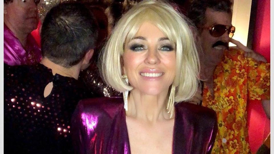 Elizabeth Hurley’s age-defying New Year party pic in purple, plunging ...