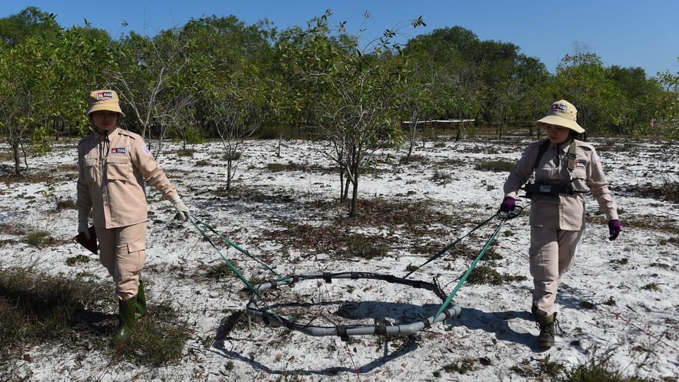 Photos: Vietnamese women clear countryside of war-era mines | Hindustan ...