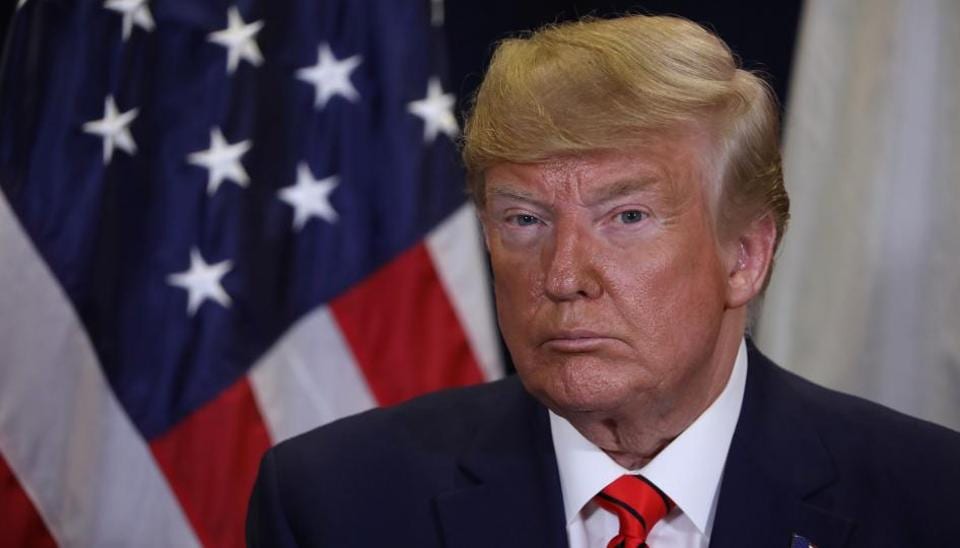 US President Donald Trump signs $100 billion coronavirus relief package ...