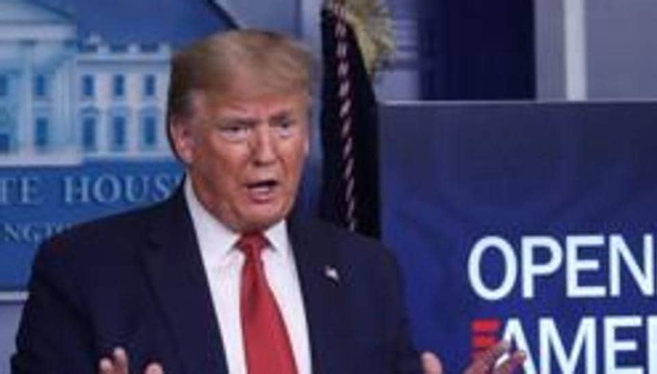 Record one-day spike in Covid-19 deaths, Donald Trump unveils reopening ...
