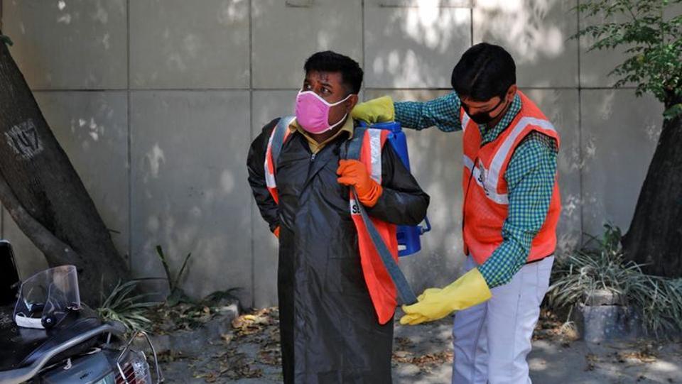 Photos: On the road with a sanitation worker disinfecting the capital ...