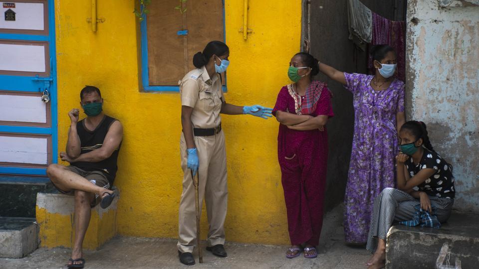 Police step up security measures in Mumbai slums to contain spread ...