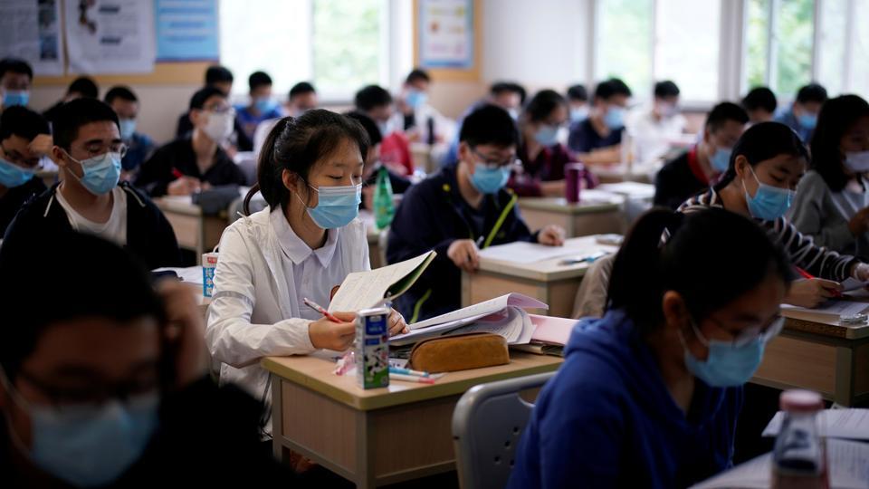 Chinese city in partial lockdown, reopened schools shut after cluster ...