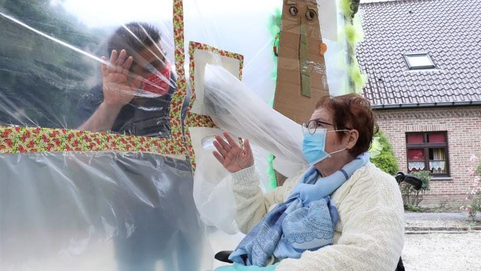 Hug curtain installed at Belgian retirement home for safe embrace ...