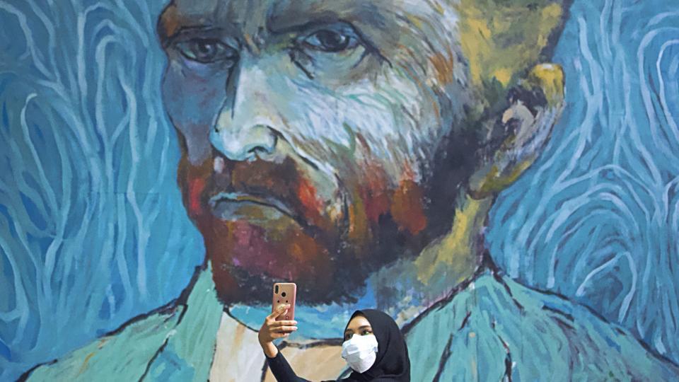 Photos: Indonesia’s art lovers practise social distancing inside ...