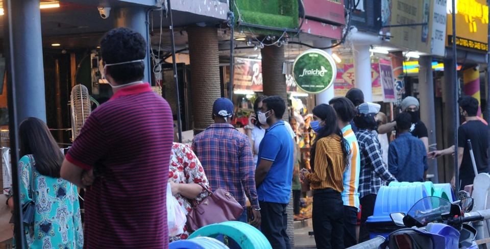 In rush for alcohol, food, residents give social distancing a go-by at ...