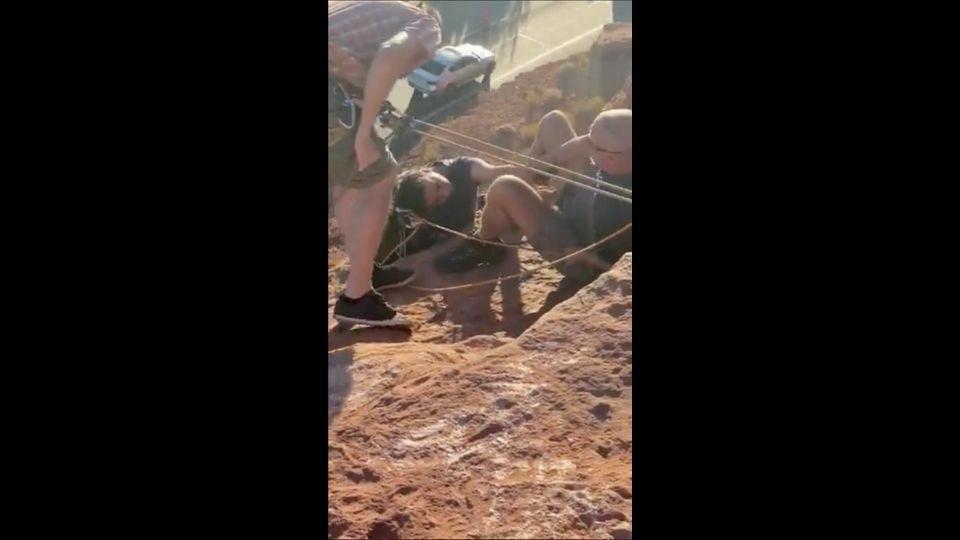 College football team heroically rescues woman hanging from cliff. Watch incredible video | Trending